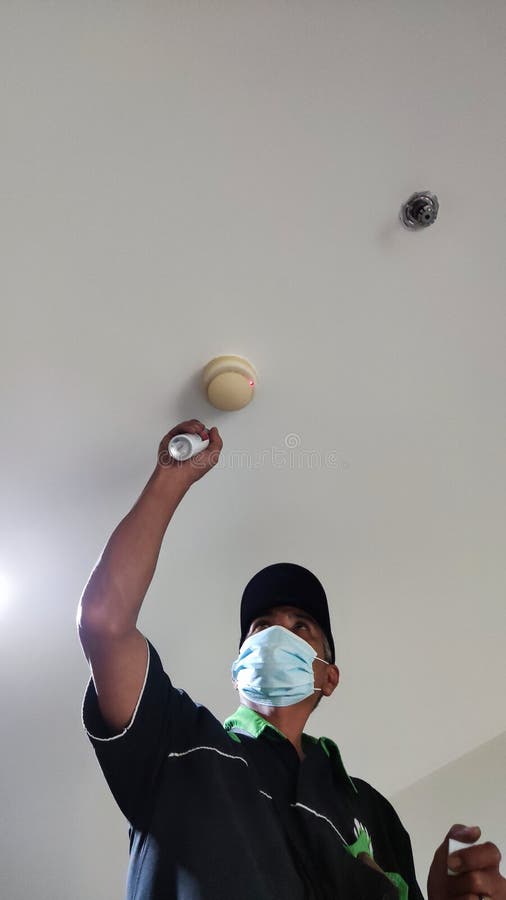 The Technician is Checking the Smoke Detector Editorial Photo - Image ...