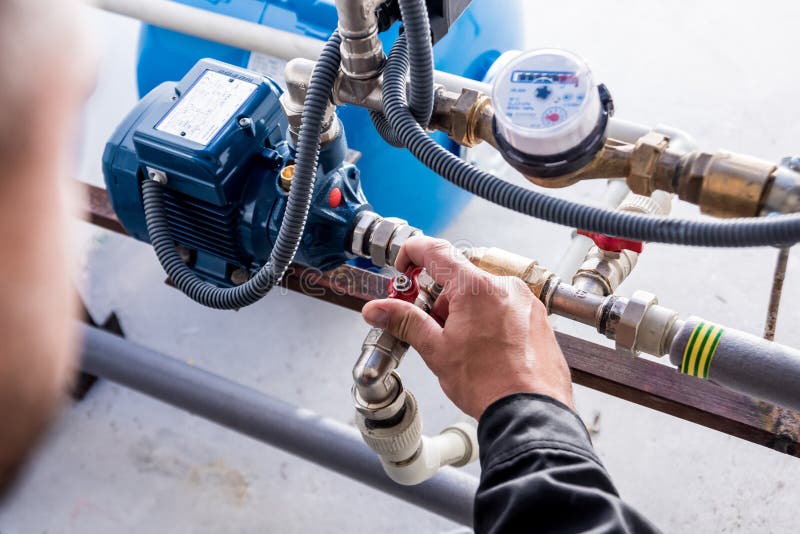 Technician Checking Water System Nodes.Modern Industrial Background ...