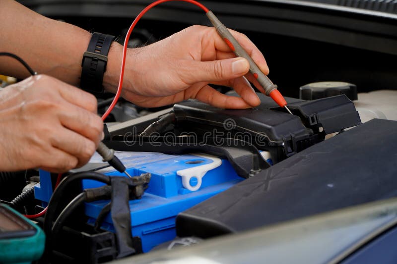 Technician Checks the Battery Using a Voltmeter Capacity Tester,auto ...