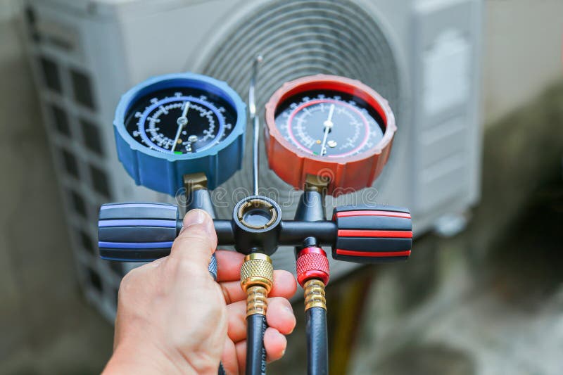 Technician Checks the Operation of the Air Conditioner Stock Photo ...