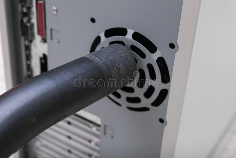 A Technician Cleaning Fan of a Computer System Box with Vacuum Cleaner ...