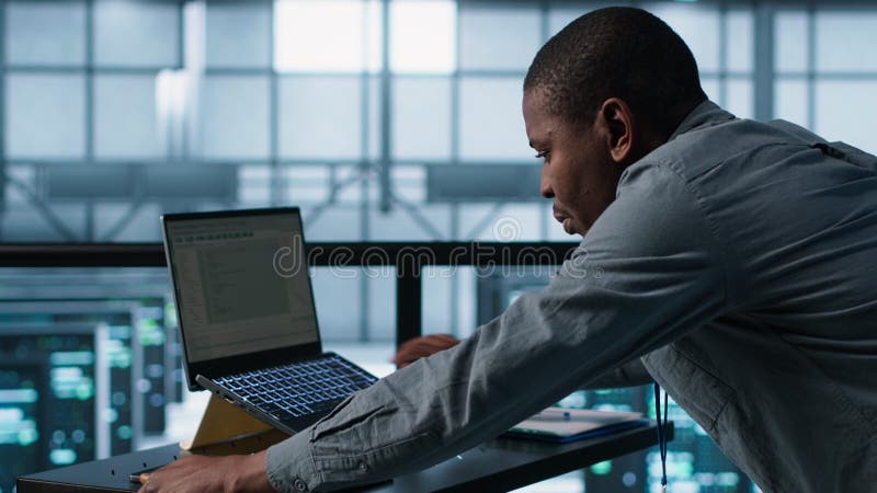 Technician Coding on Laptop in Data Center, Managing Server Virtualization Stock Video - Video ...