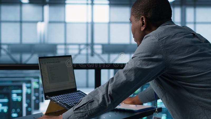 Technician Coding on Laptop in Data Center, Managing Server Virtualization Stock Image - Image ...