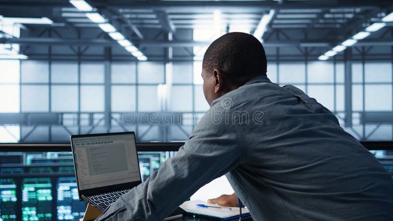 Technician Coding on Laptop in Data Center, Managing Server Virtualization Stock Photo - Image ...