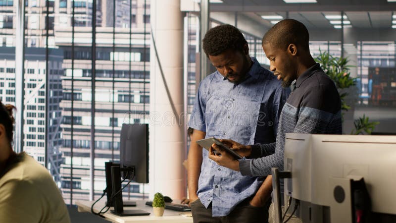 It Staff Members in Office Monitoring Company Systems Using Tablet ...