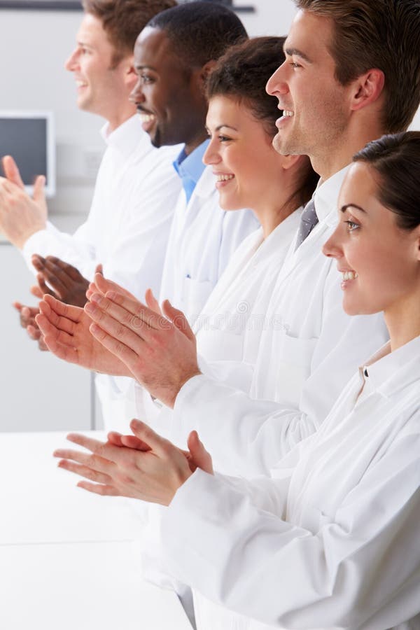 Technician and Colleagues in Laboratory Clapping Stock Photo - Image of ...