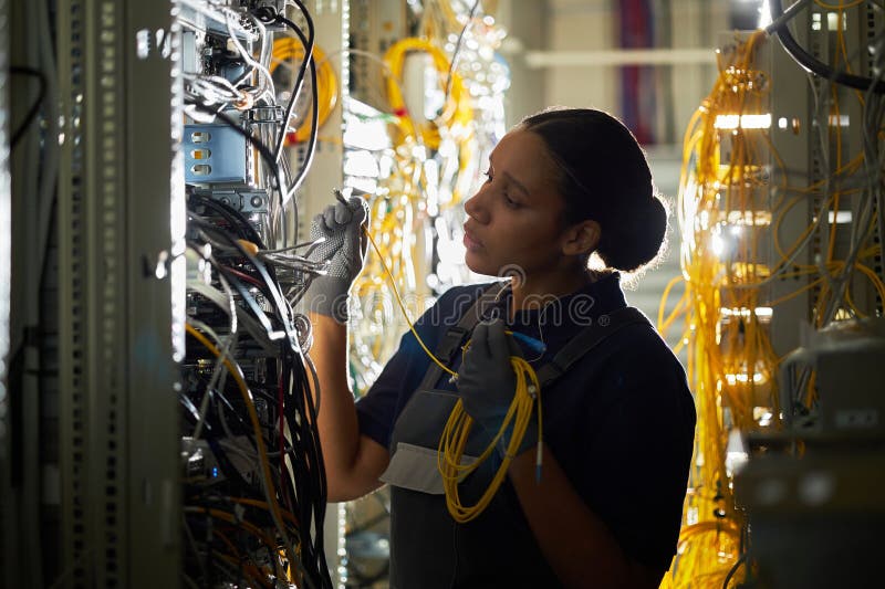 Technician Configuring Network Cables in Server Room Stock Photo - Image of communication ...