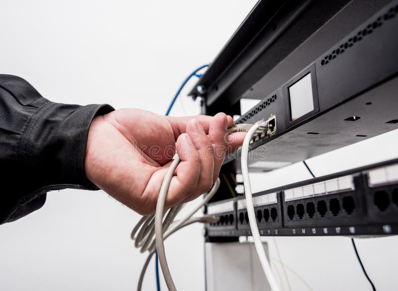 Technician Connecting Network Cables To Switches. Connecting Cables ...