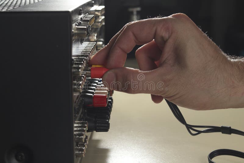 A Technician Connects a Fiber Optic Internet Cable in a Server Room. a ...