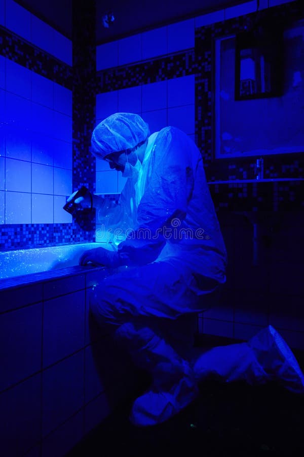 Technician Criminologist Working Under UV Light Stock Photo - Image of ...