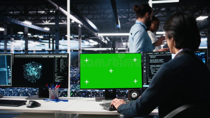 Technician in Data Center Coding with Generative AI on Green Screen PC ...