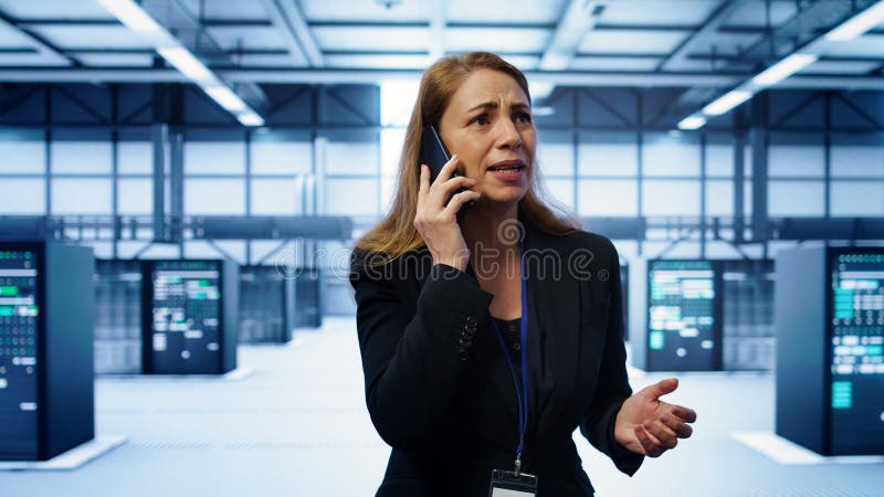 Technician in Data Center Talking in Phone Call, Doing Yearly ...