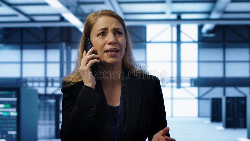 Technician in Data Center Talking in Phone Call, Doing Yearly ...