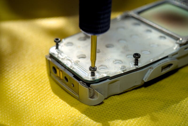 Technician Disassembling Components of Broken Phone for Repair Stock ...