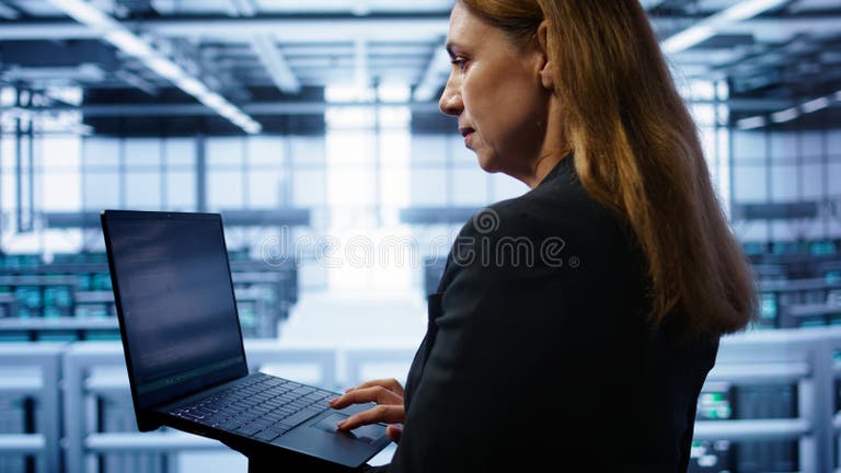 Technician Doing Checkup, Inputting Data on Laptop of Needed Server Hub ...