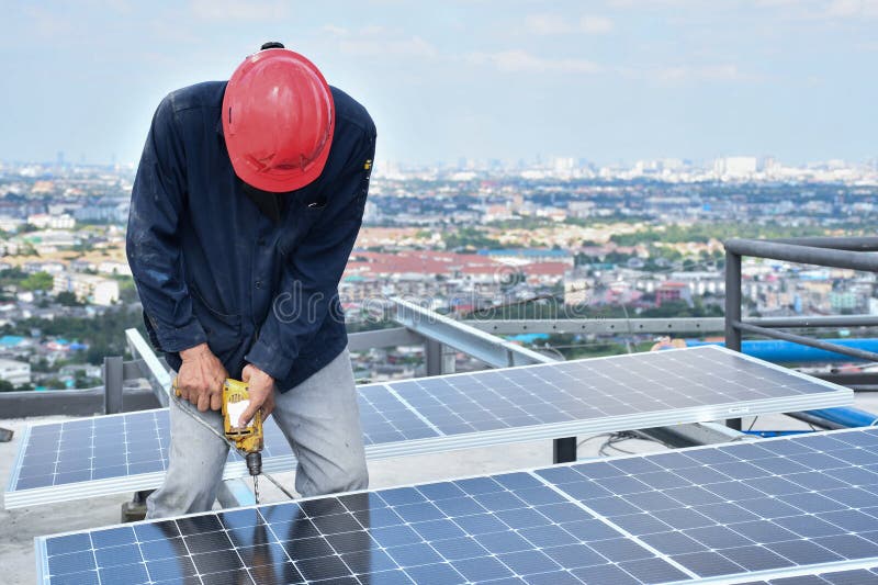 The Technician is Drilling Holes To Mount the Solar Panel Cell with ...