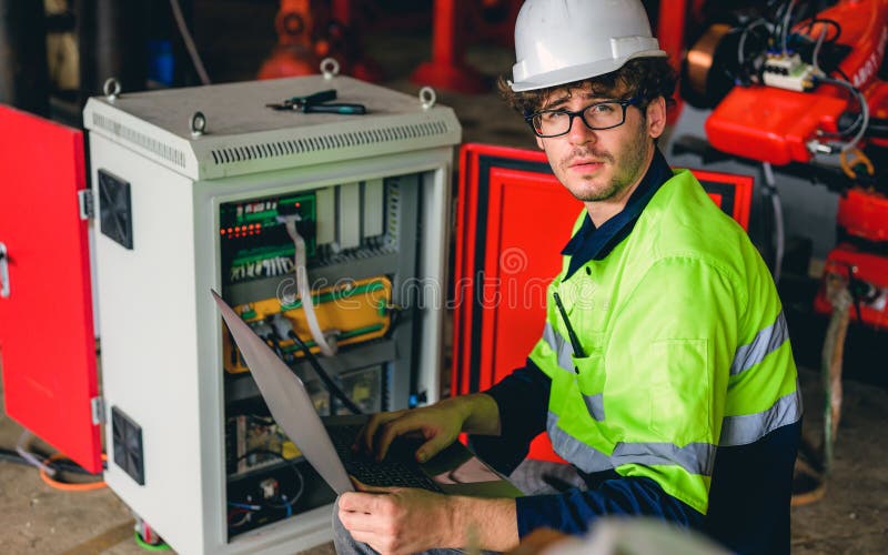 Technician Engineer Checking and Repairing Automatic Robotic Machine ...