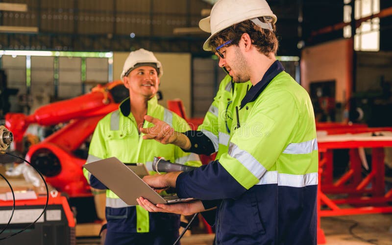 Technician Engineer Checking and Repairing Automatic Robotic Machine ...