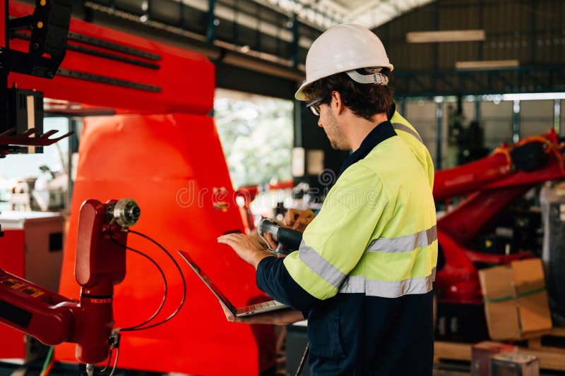 Technician Engineer Checking and Repairing Automatic Robotic Machine ...