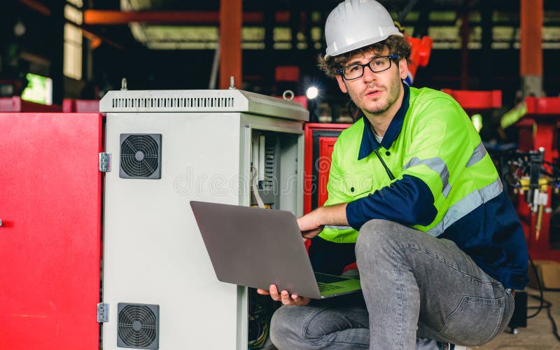 Technician Engineer Checking and Repairing Automatic Robotic Machine ...