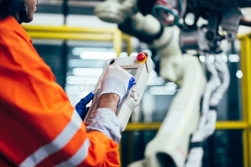 Technician Engineer Holding Robot Controller Checking Automatic Robotic ...