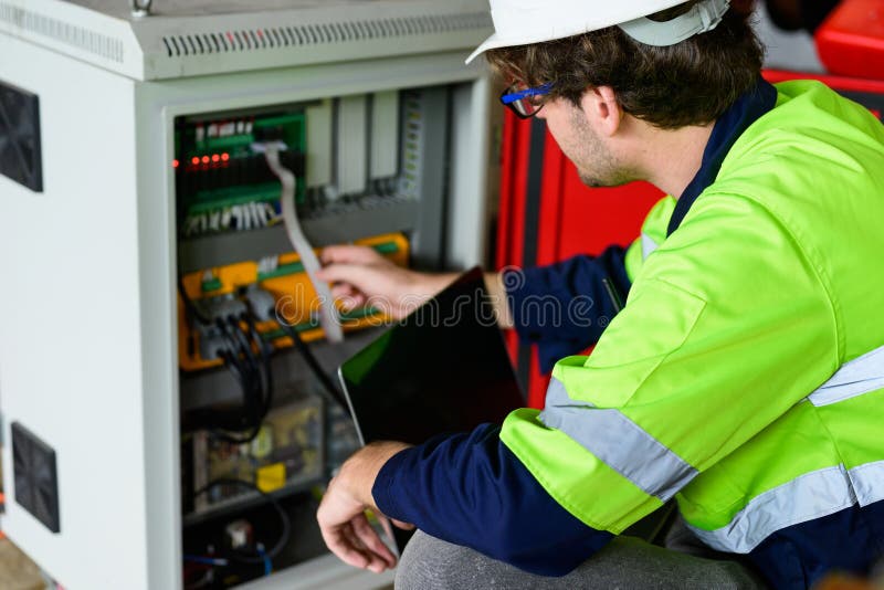 Technician Engineer Holding Robot Controller Checking and Repairing ...