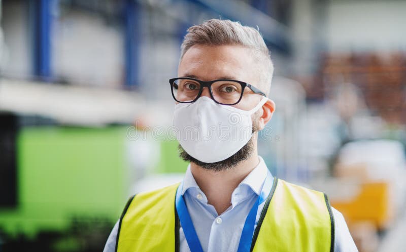 Technician or Engineer with Protective Mask Standing in Industrial ...