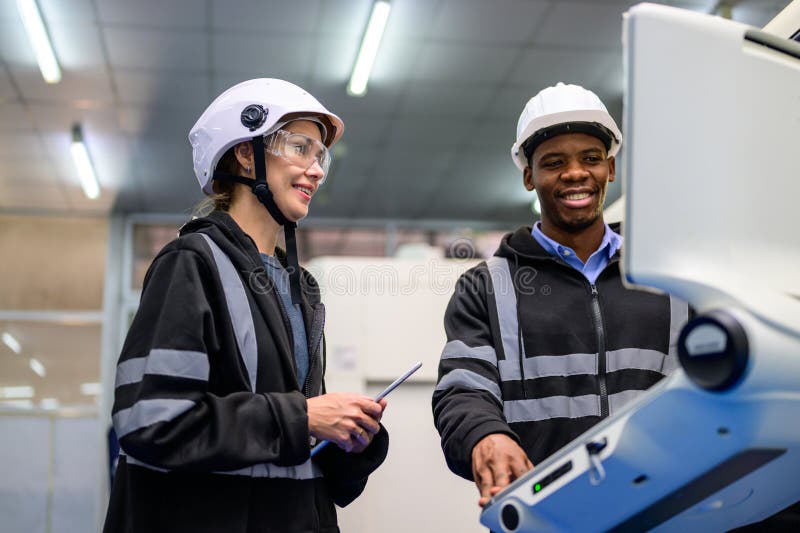 Technician with White Helmet Checking and Repairing Part Stock Photo ...