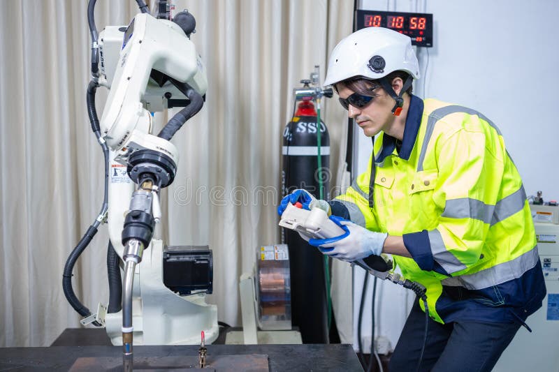 Technician Engineer Using Remote Control Automation Robotics at ...