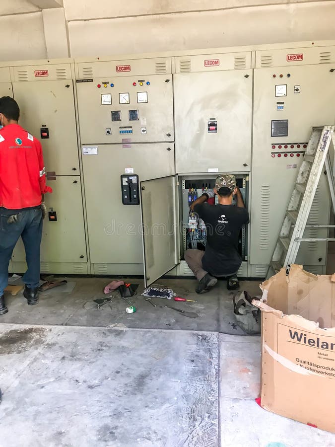 Technician and Engineer Working on Maintenance at Main Switchboard MSB ...