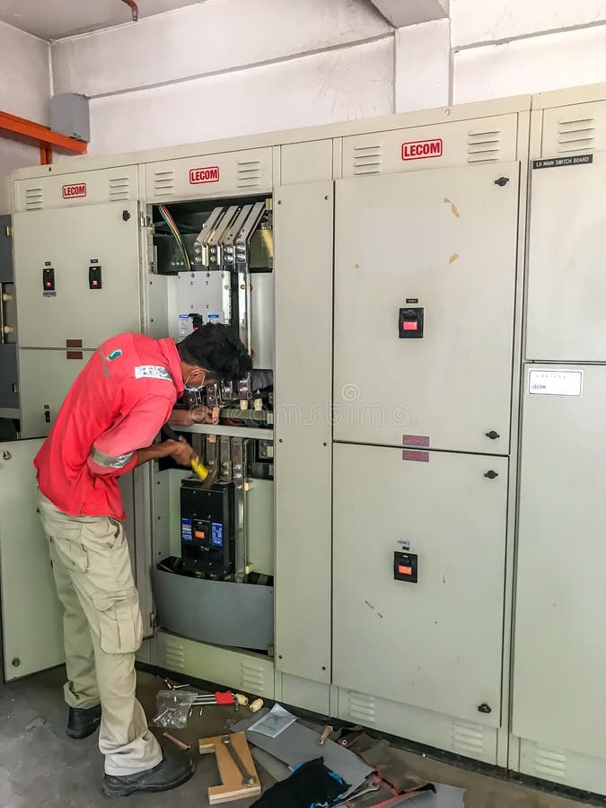 Technician and Engineer Working on Maintenance at Main Switchboard MSB ...
