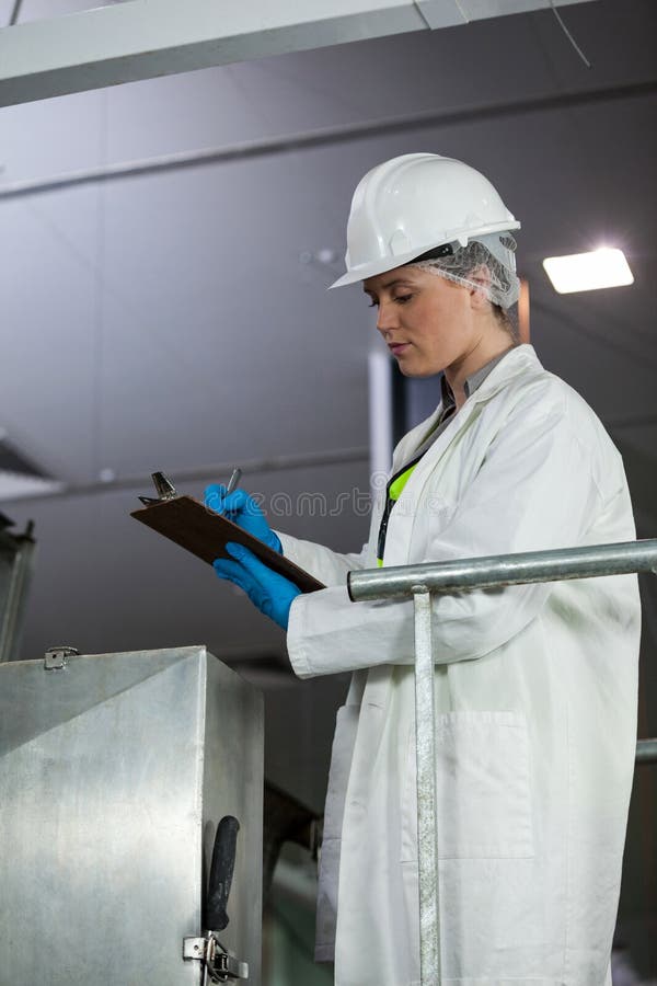 Technician Examining Meat Processing Machine Stock Photo - Image of ...