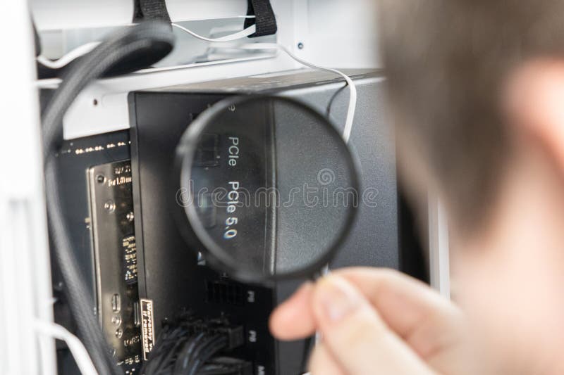 Technician Examining PCIe 5.0 Label on Modular Power Supply Unit ...