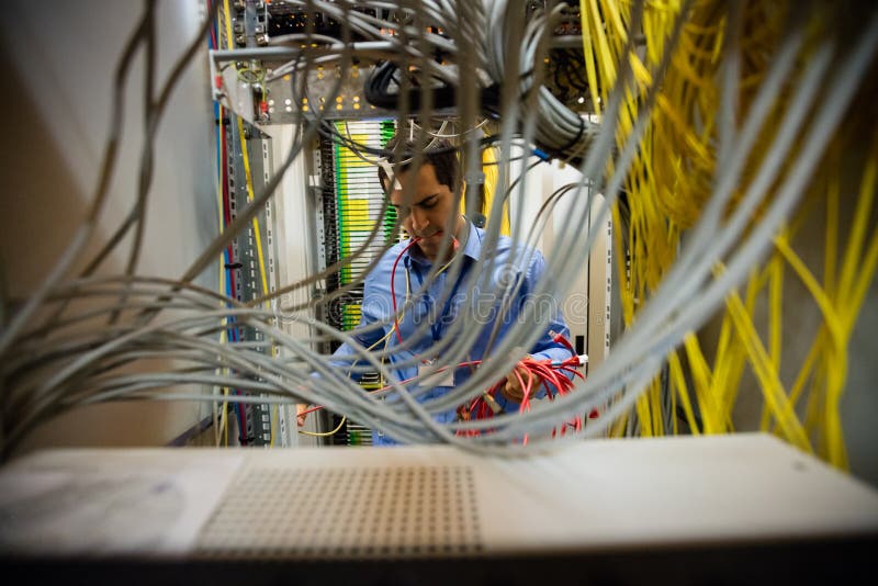 Technician fixing cable stock photo. Image of formal - 78694164