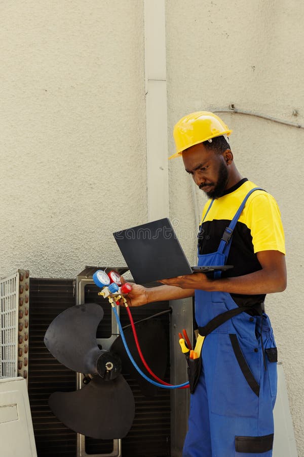 Technicians Refilling Condenser Freon Stock Photo - Image of seasoned ... Technicians Refilling Condenser Freon Stock Photo - Image of seasoned ...
