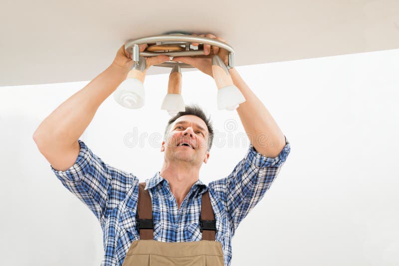 Technician Fixing Light on Ceiling Stock Photo - Image of maintenance ...