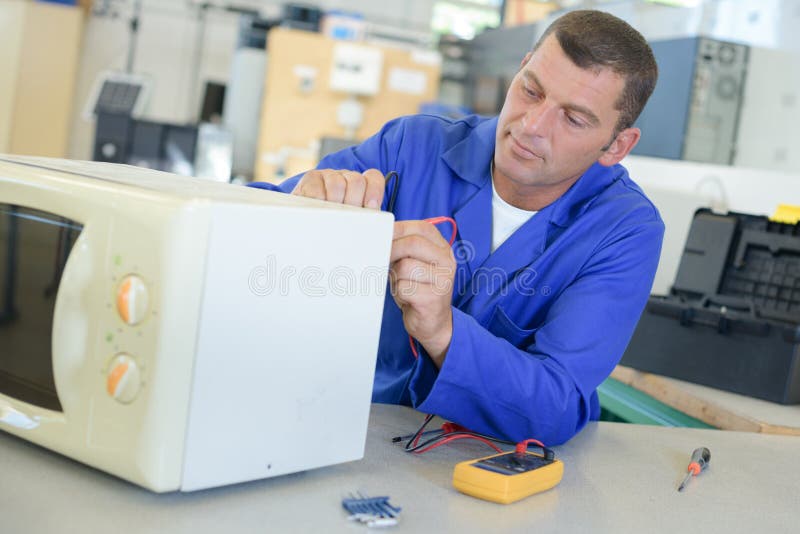 Technician Fixing Microwave Oven Stock Image - Image of busy, flow ...