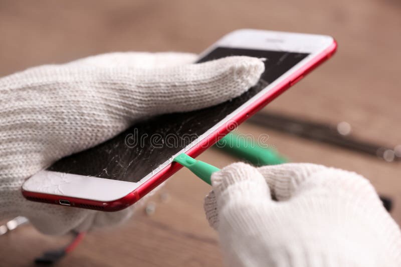 Technician Fixing Mobile Phone at Table. Device Repair Service Stock ...