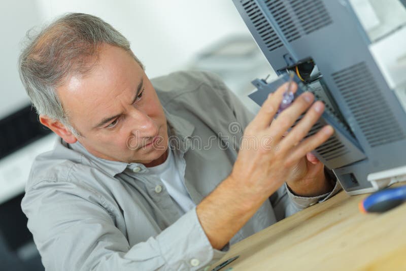 Technician fixing printer stock image. Image of caucasian - 258798241