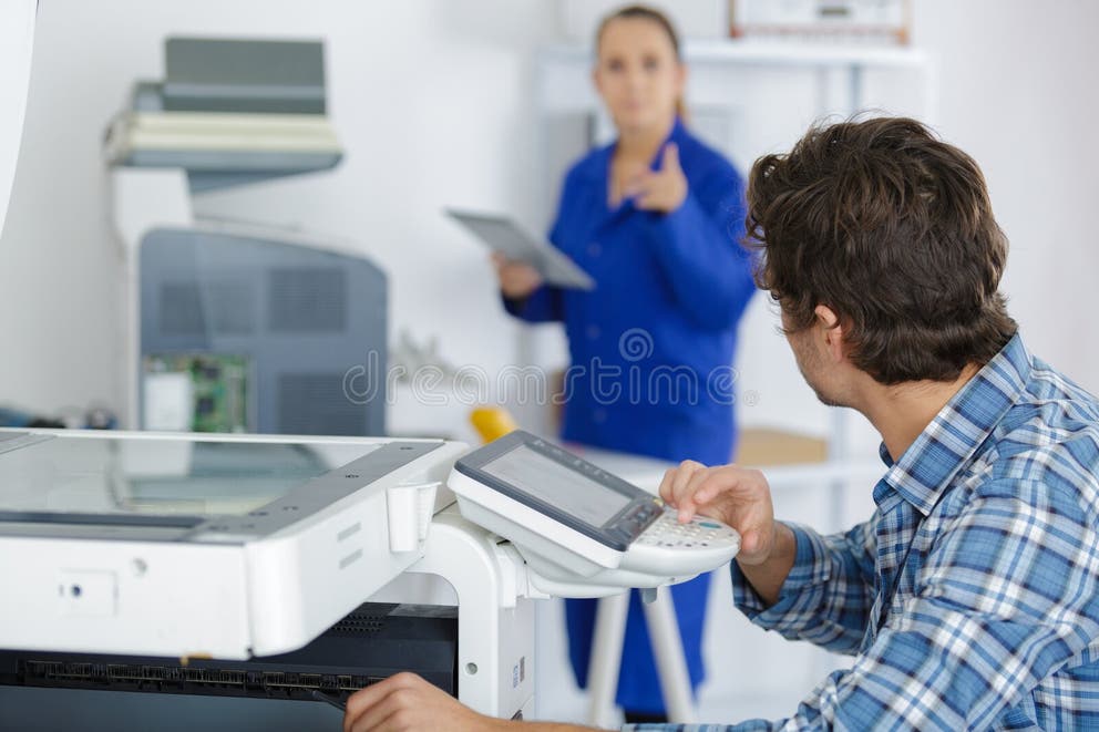 Technician fixing printer stock image. Image of male - 292891339