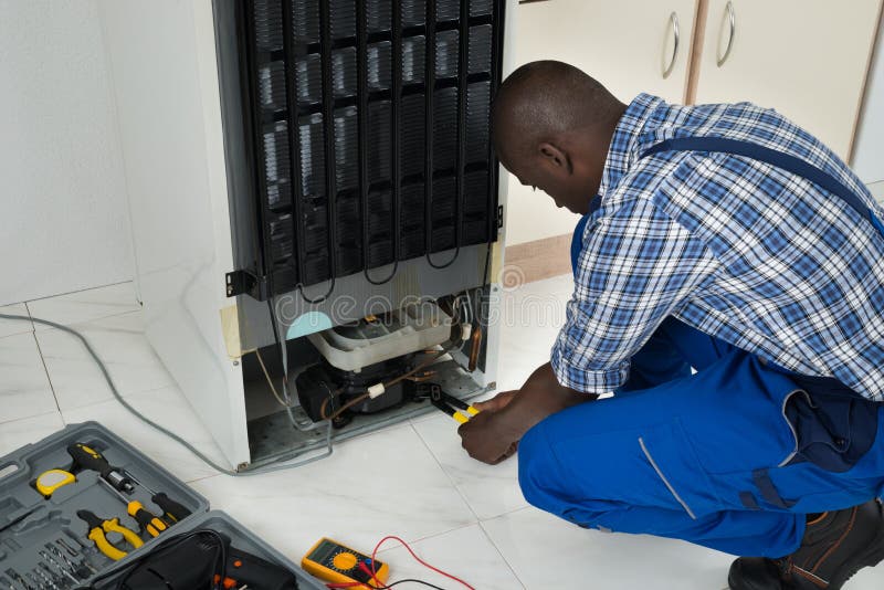 Technician Fixing Refrigerator with Worktool Stock Image - Image of ...