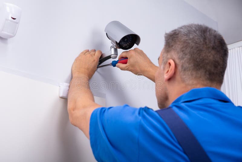 Technician Fixing Security Camera Stock Photo - Image of installer ...