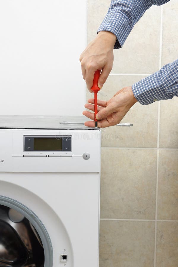 Technician Fixing Washing Machine with Screwdriver Stock Image - Image ...