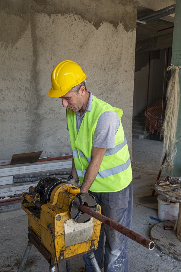 Technician is Grooving Steel Pipe. Iron Pipe Master Working Iron Pipes ...