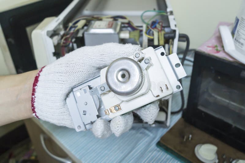 Technician Hand with Microwave Timer Switch, Checking Microwave, Home ...