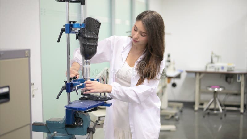 Technician Testing Robotic Bionic Arm at Prosthetic Manufacturing Stock ...