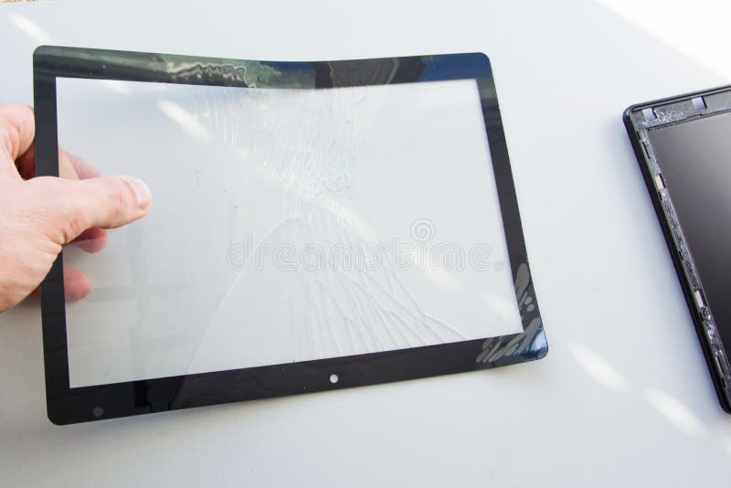 A Technician Holds in His Hand the Broken Touch Screen Glass of Tablet ...