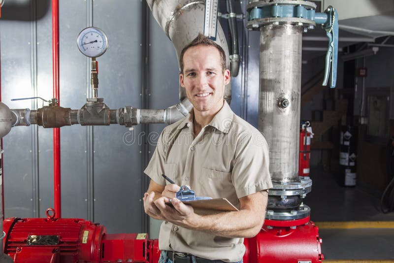 Technician Inspecting Heating System in Boiler Stock Photo - Image of ...