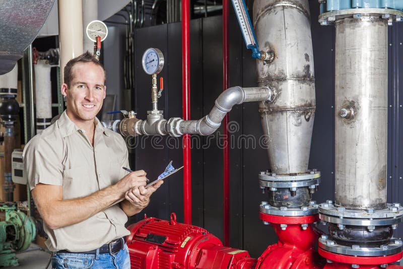 Technician Inspecting Heating System in Boiler Stock Photo - Image of ...