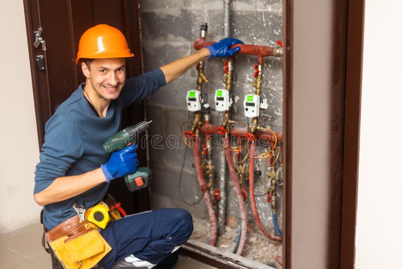 Technician Inspecting Heating System in Boiler Room Stock Photo - Image ...